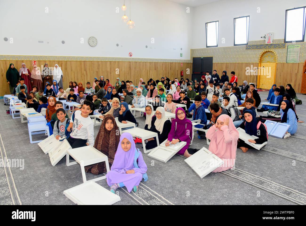 Women wearing Islamic veils seen with part of their students during an ...