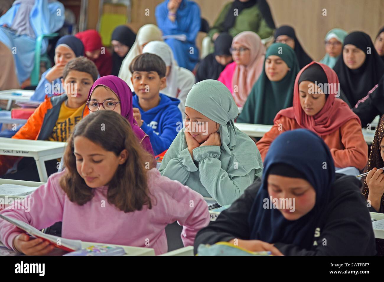 Students with Islamic veils seen during an Arabic class lesson at the ...