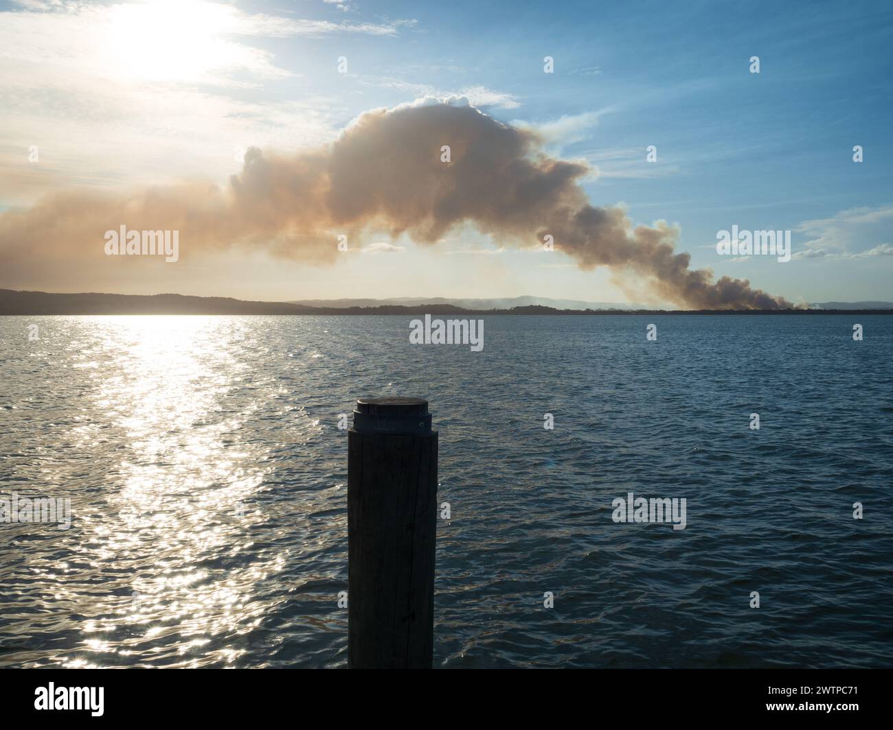 Smoke from a distant fire across the water from Long Jetty NSW ...