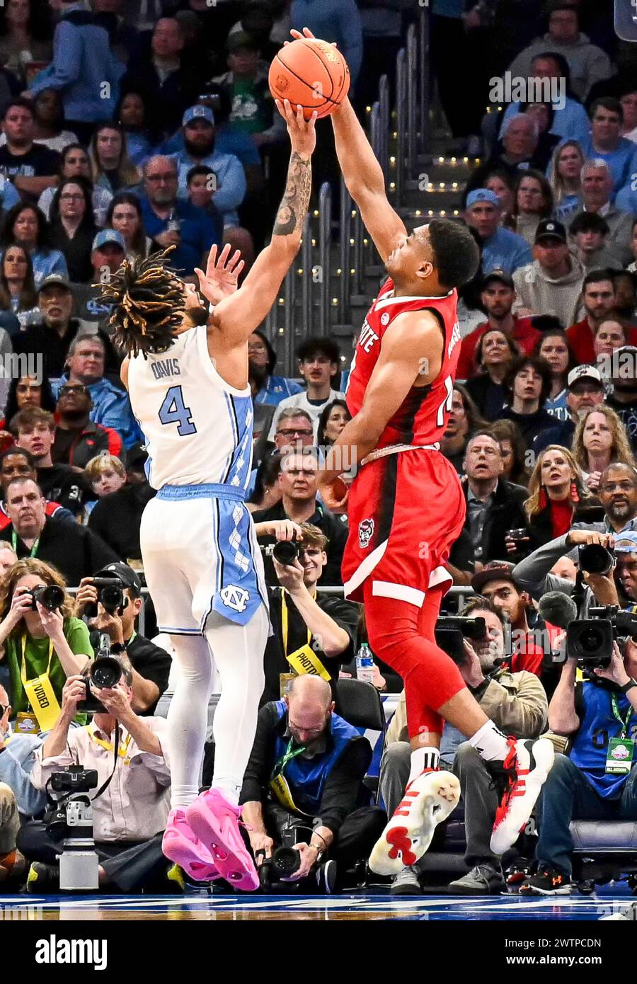 WASHINGTON, DC - MARCH 16: North Carolina State Wolfpack guard Casey Morsell (14) blocks the ...