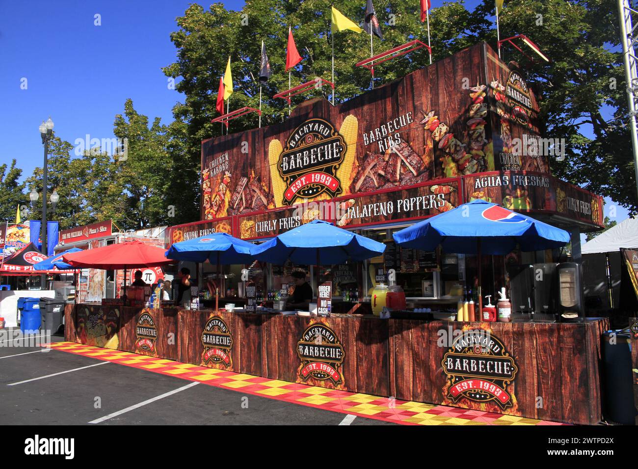 Backyard Barbeque Vendor with blue sky and trees Stock Photo - Alamy