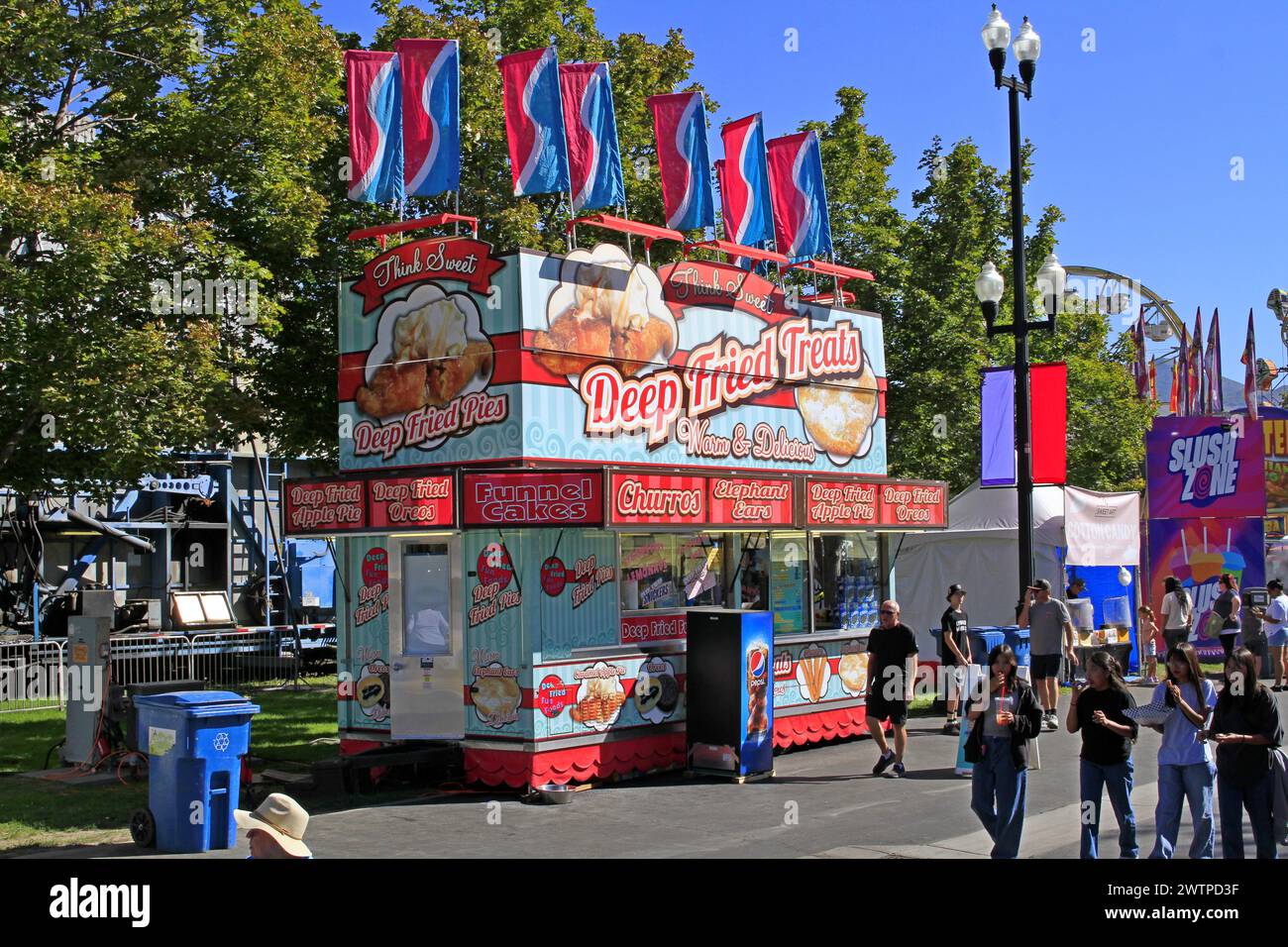 Utah State Fair with blue sky and by a DEEP FRIED TREATS Vendor Stock ...