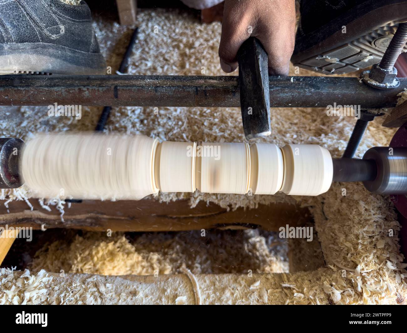 Turner working on a lathe in the workshop curving woods Stock Photo - Alamy