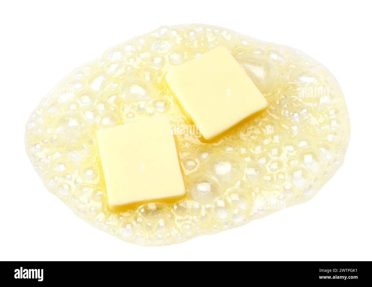 Two pieces of butter melting isolated on white background Stock Photo ...