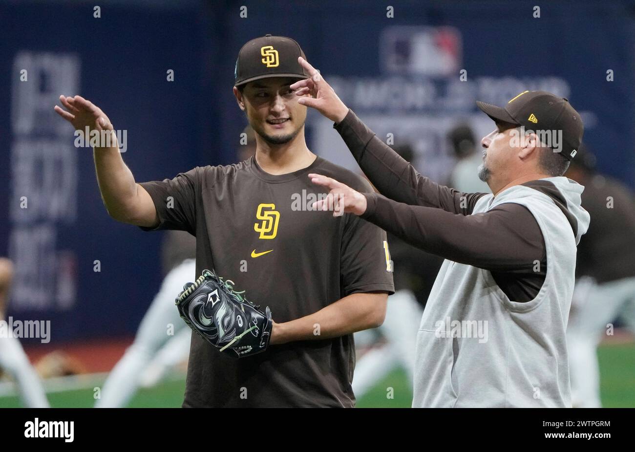 San Diego Padres' pitcher Yu Darvish, left, attends a baseball workout ...