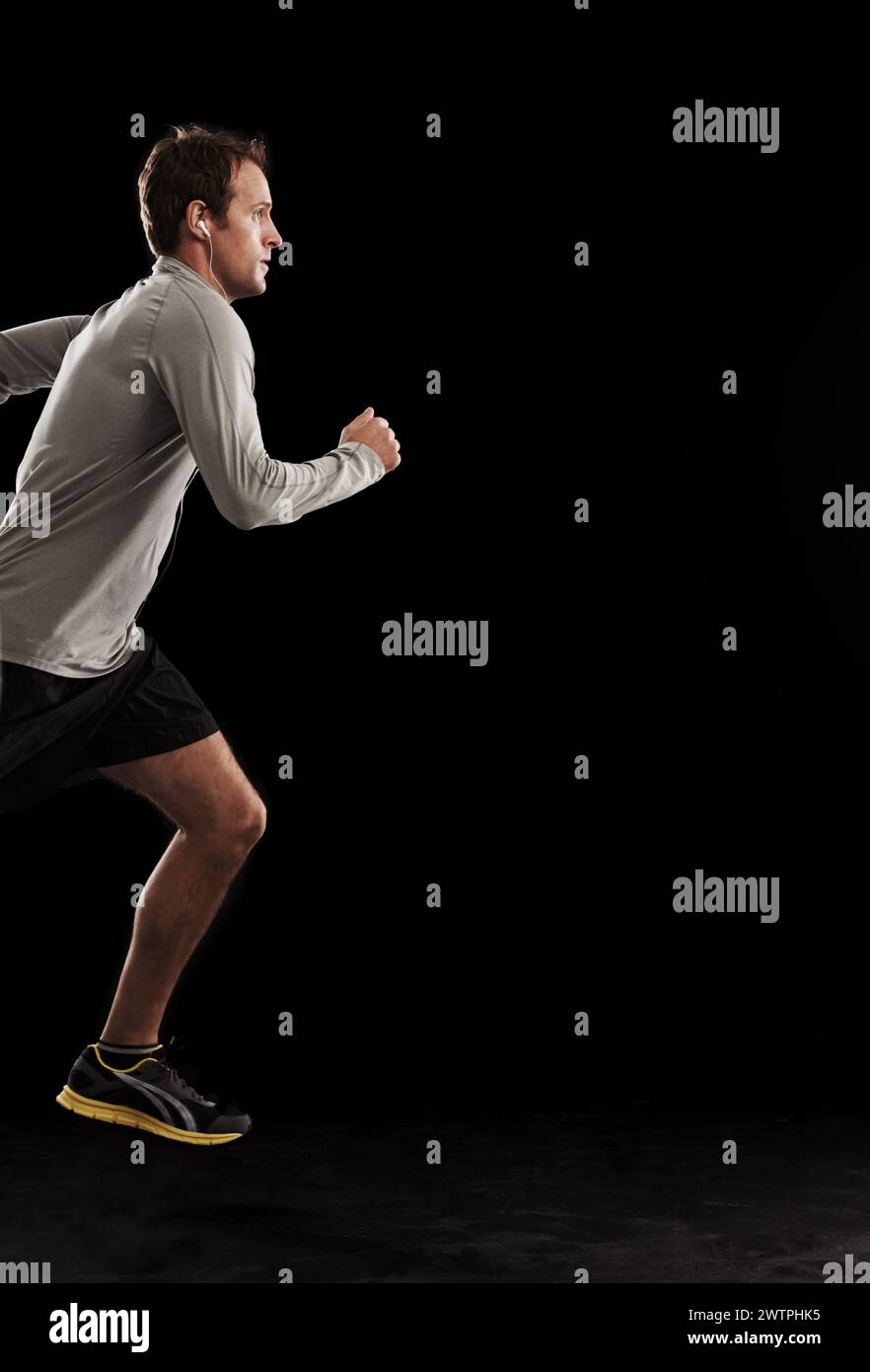 Man, cardio and running exercise in studio for athlete performance or ...