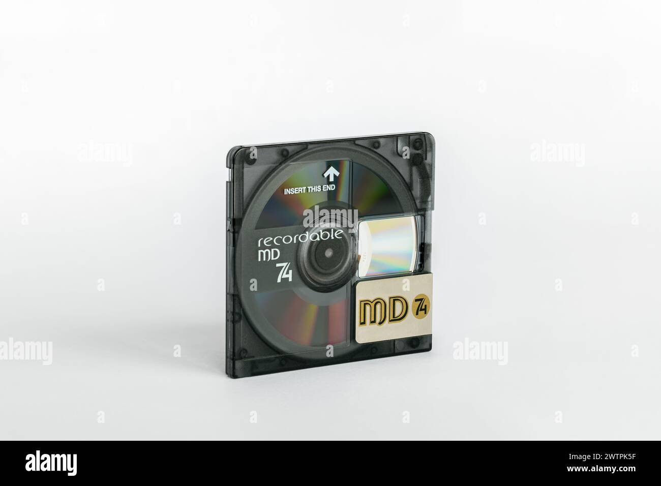 A minidisc with an open protective flap and a rainbow reflection from ...