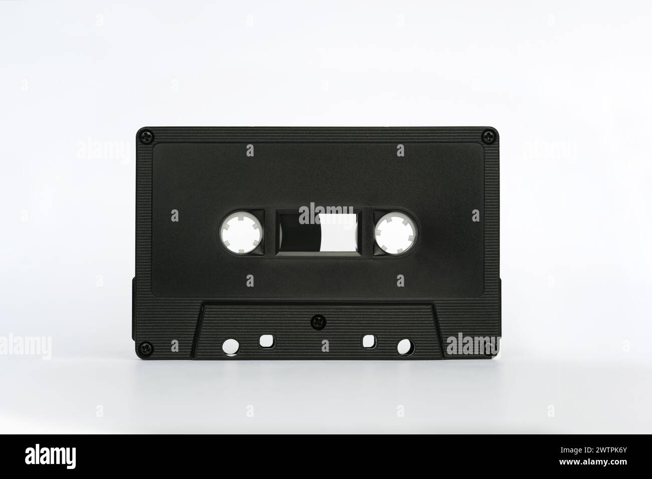 Front view of black audio cassette standing isolated on white ...