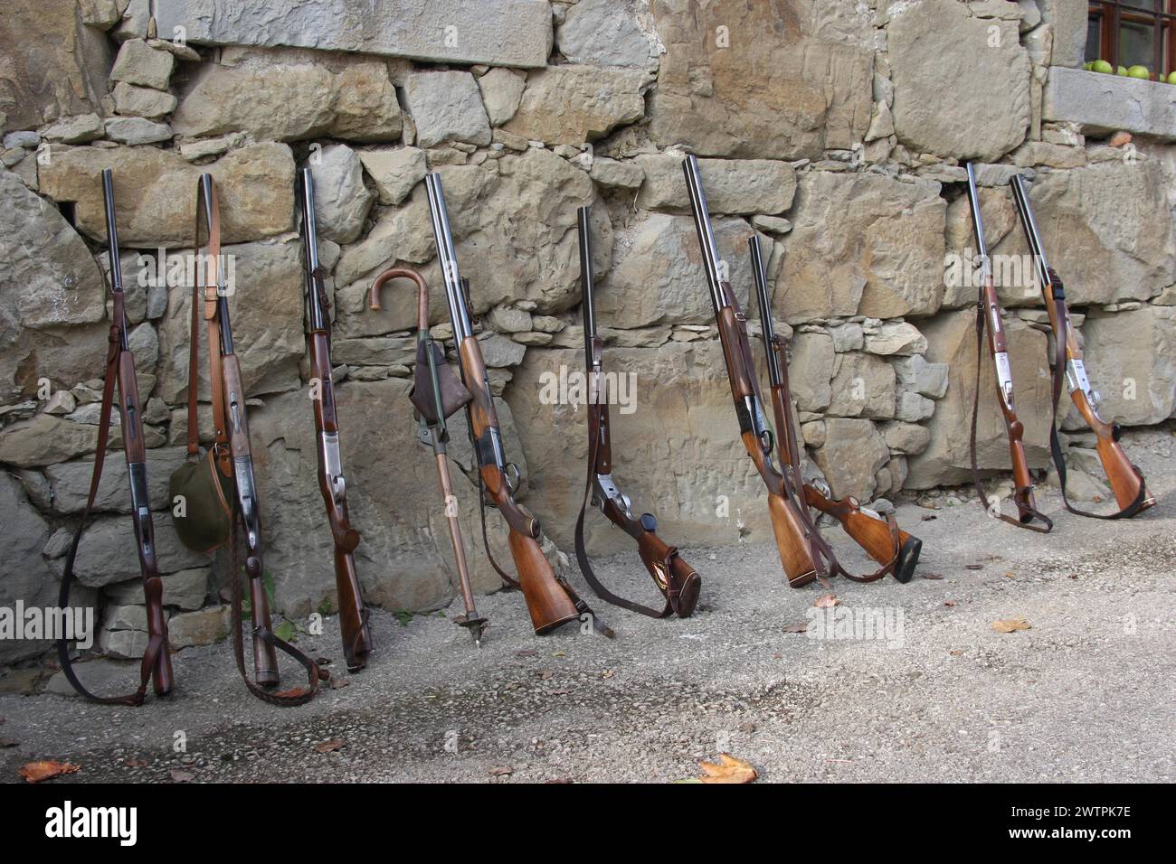 Hunting rifles, so-called shotguns, leaning against a house wall, Lower ...