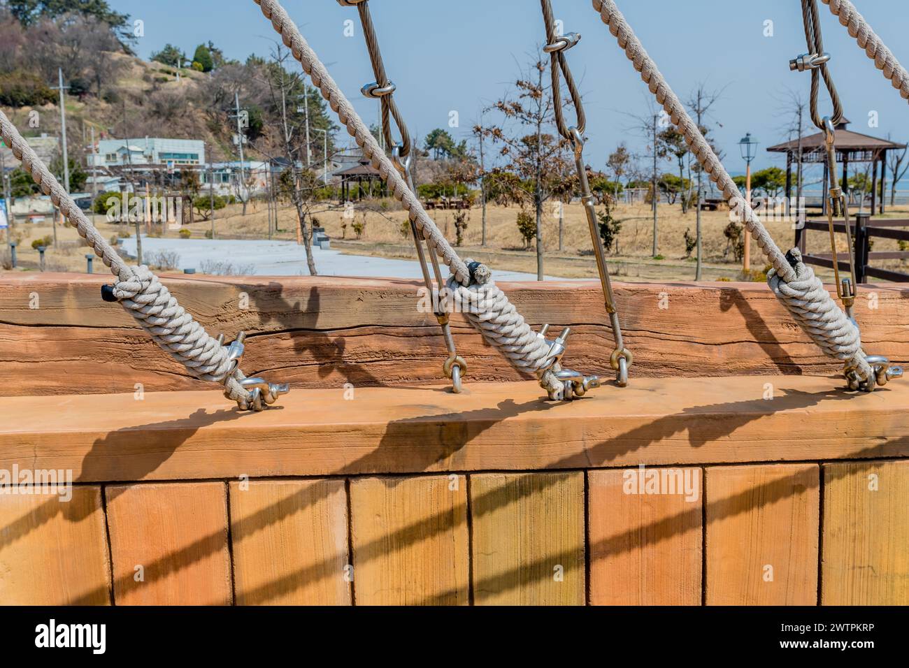 Three ropes with heaving line knots holding rigging of sailing vessel ...