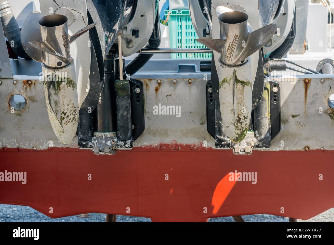 Twin ship propellers covered with barnacles, awaiting maritime ...