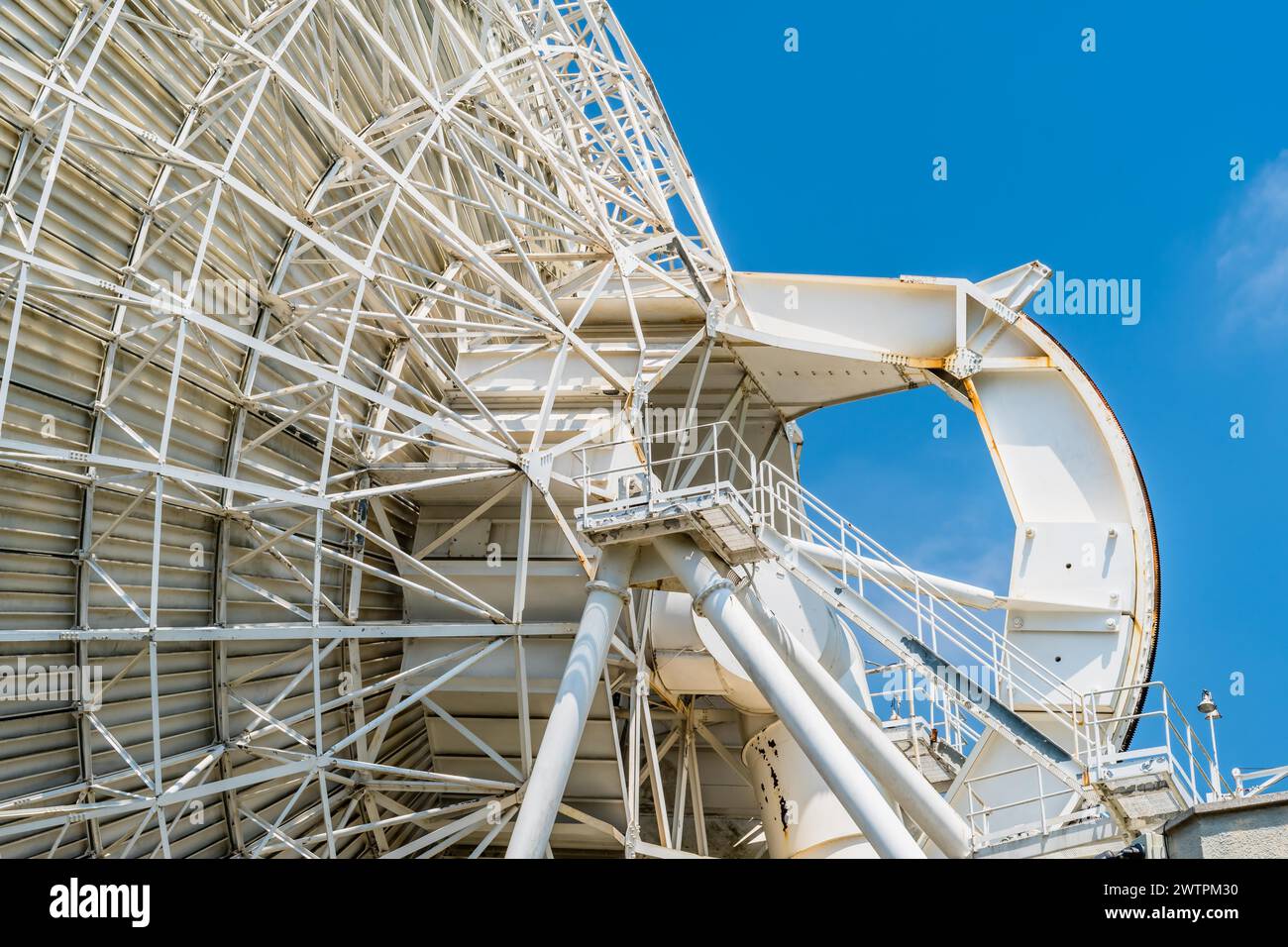 Steel framework of a satellite dish viewed from a diagonal angle below ...