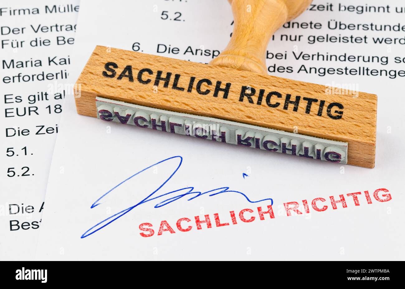 A wooden stamp is placed on a document. Inscription Factually correct ...