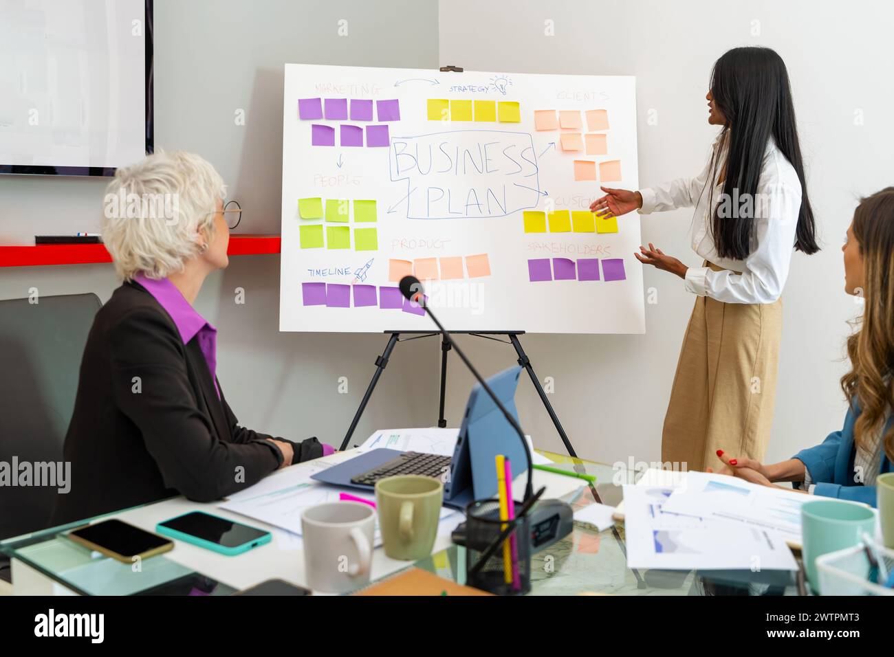 Confident African entrepreneur - Presenting strategic business plan ...