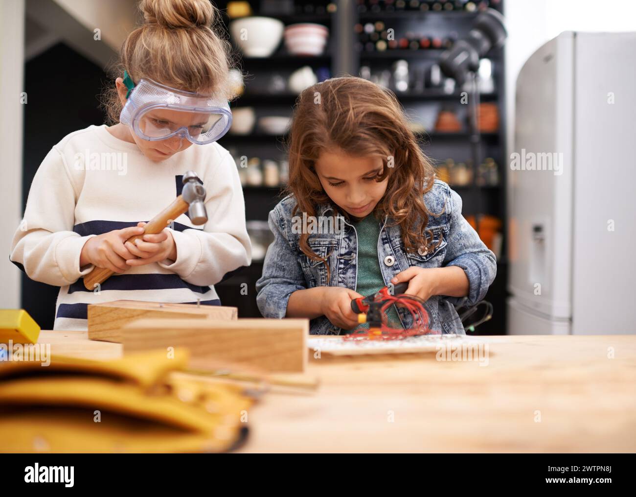 Children, construction and building in workshop with tools, play and ...