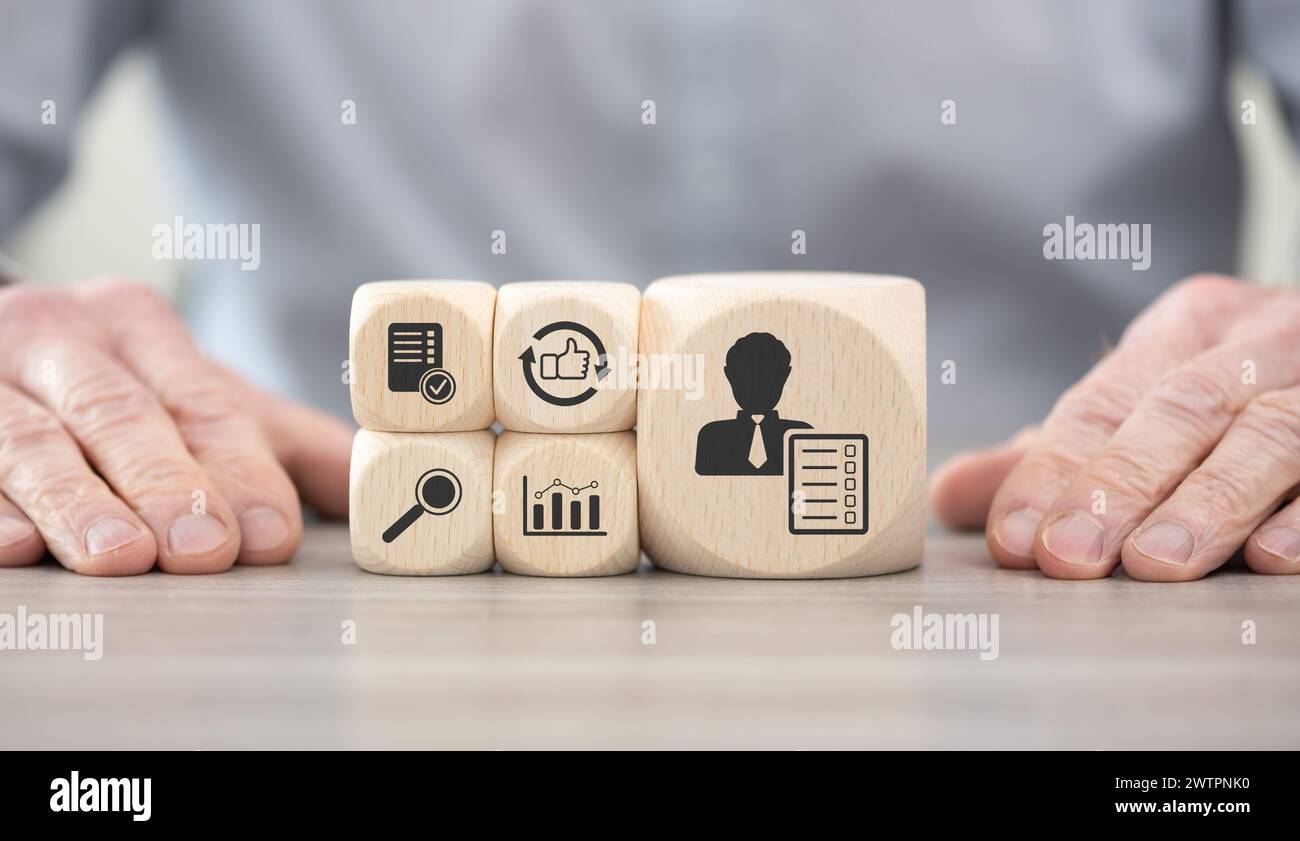 Wooden blocks with symbol of assessment concept Stock Photo - Alamy
