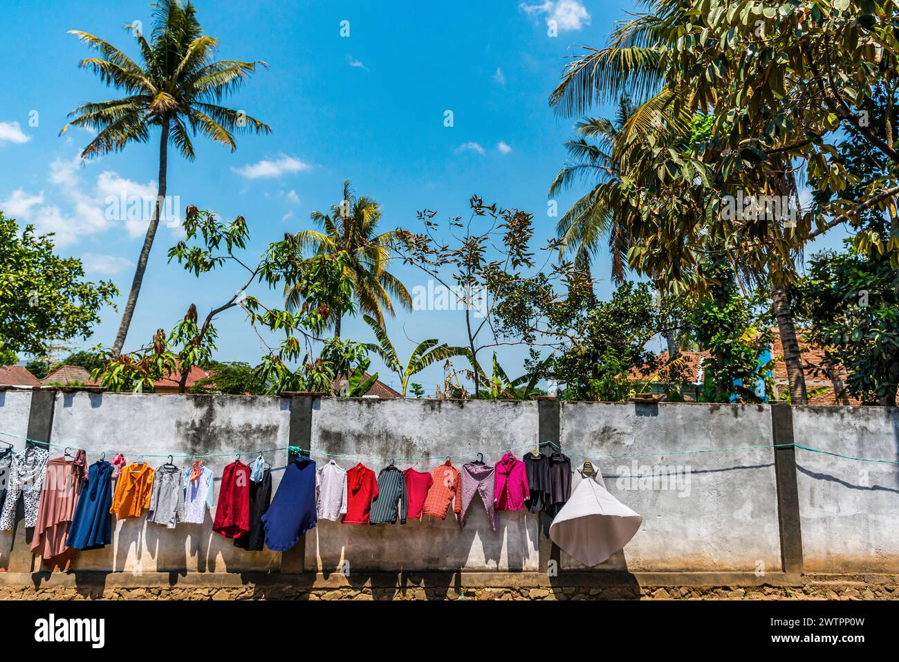 Laundry drying in the sun on a backyard, clothesline, traditional ...