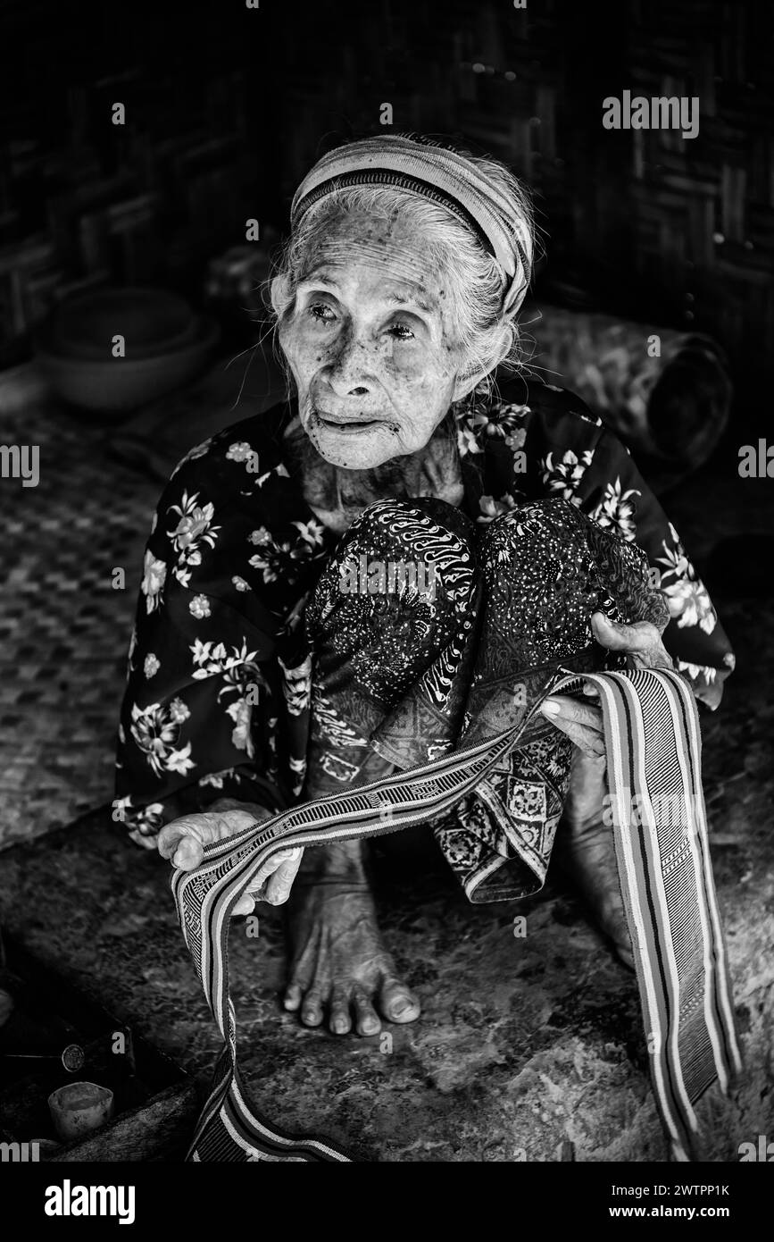 Old woman offering textiles for sale, textile, old age, human, work ...