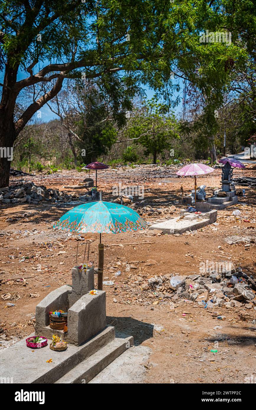 Grave in a cemetery with umbrella and offerings, Hindu, Hindu, world ...