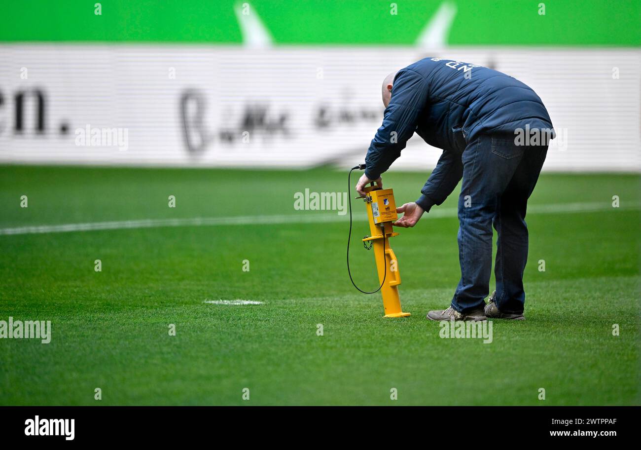 Greenkeeper Gaertner measures density and moisture in the lawn, Clegg ...