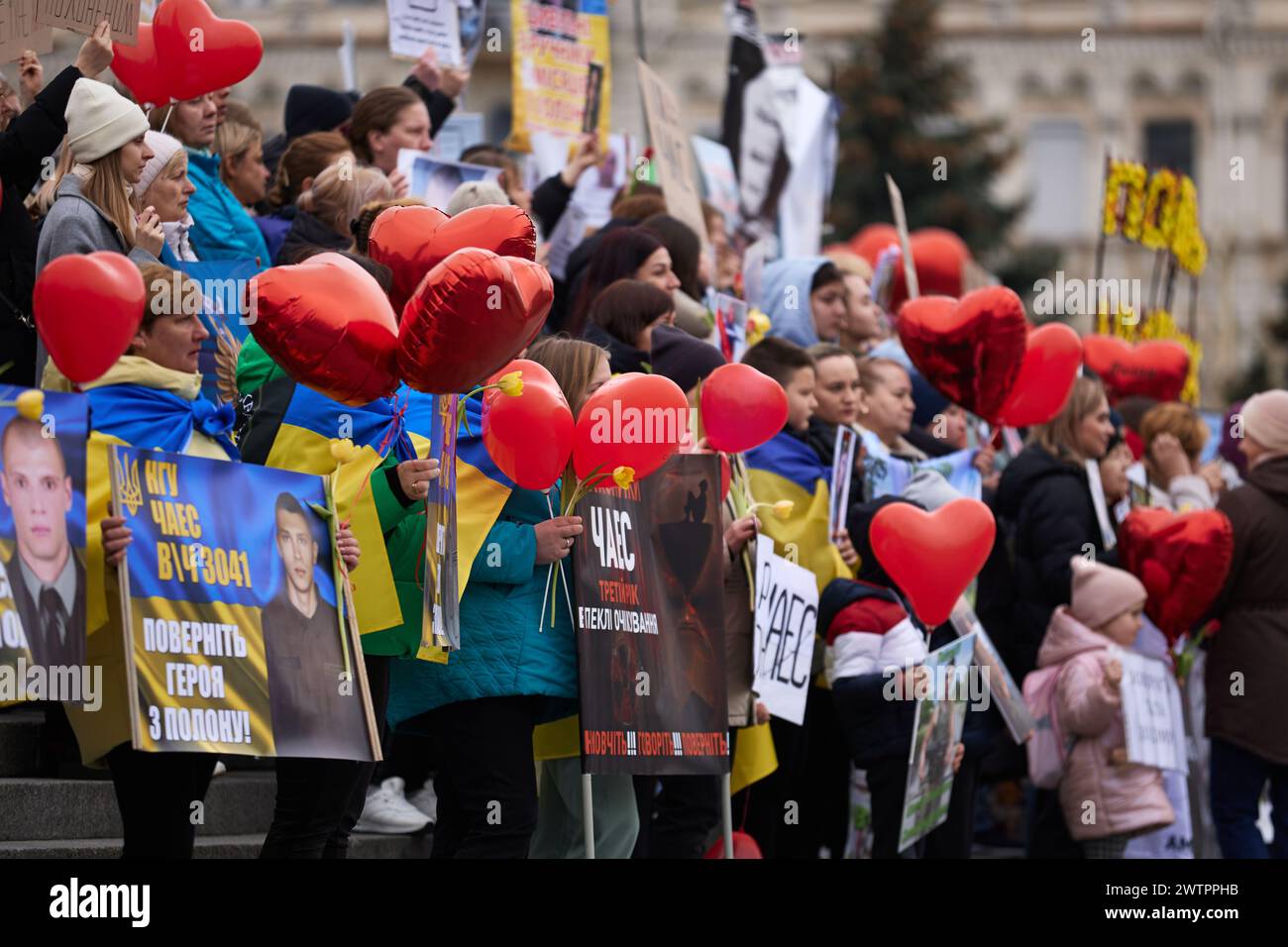 Ukrainian women hold banners and portraits of missing soldiers at the ...