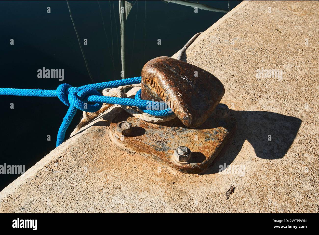 View of the Noray with blue rope Stock Photo - Alamy