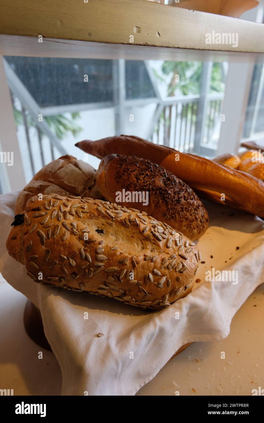 Fresh bread on display in a grocery store. Fresh whole grain bread in ...