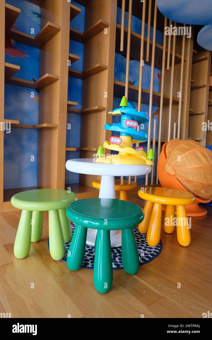 Bright colorful plastic furniture for children standing on the ...