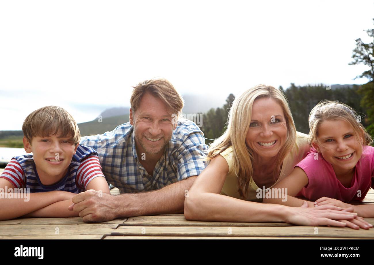 Smile, dock and portrait of family in nature for bonding, summer ...