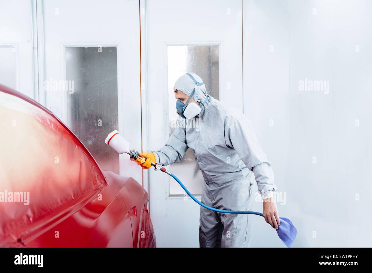 Close-up of male worker in grey costume cloth wearing chemical ...