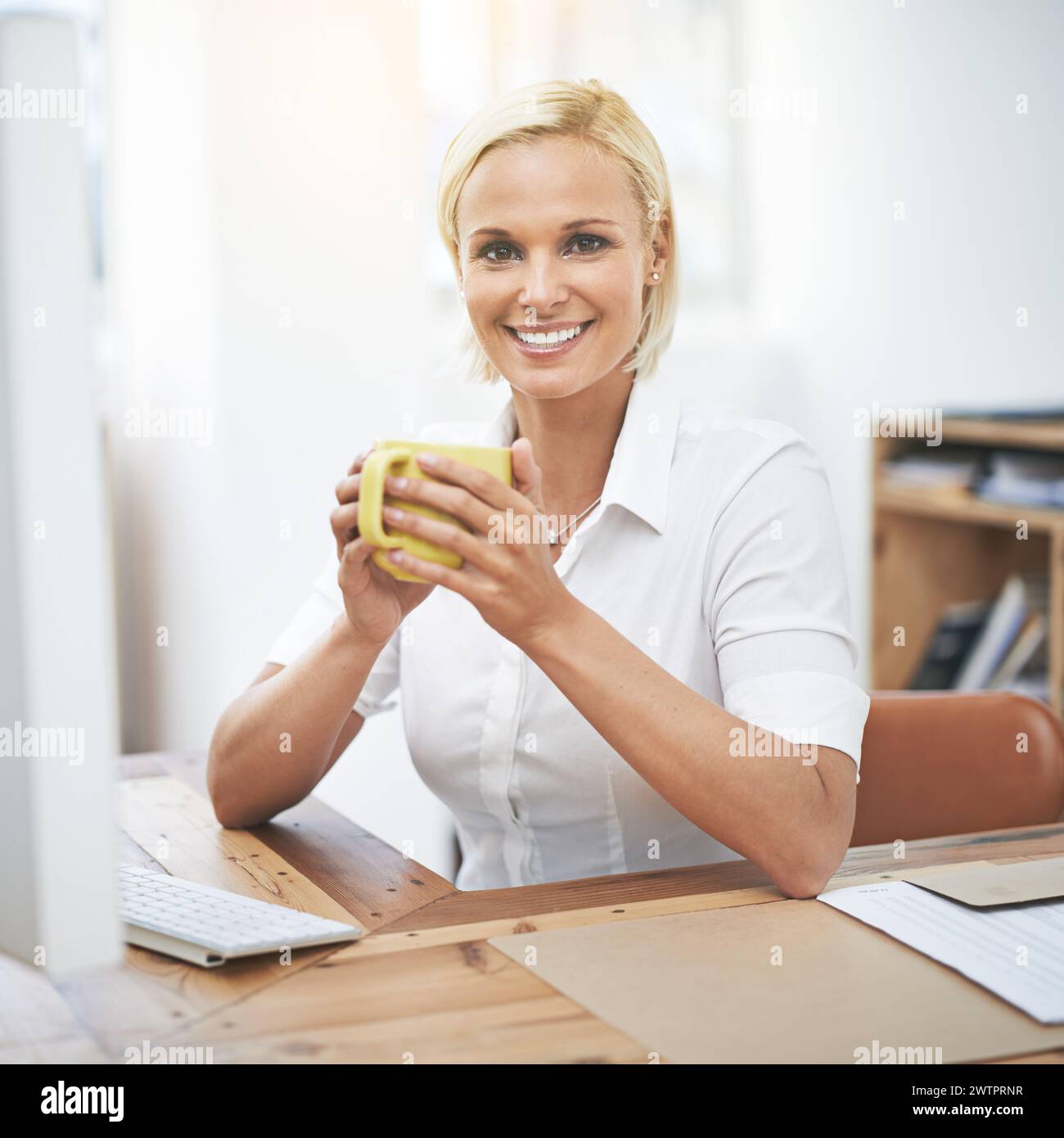 Business woman, computer and portrait with coffee, smile or pride with ...