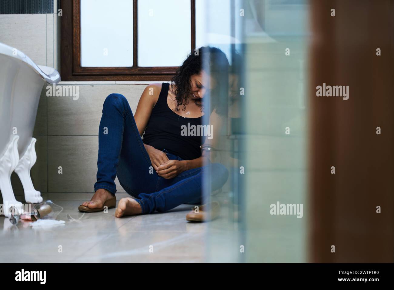 Woman, drug addict and sleep in bathroom for addiction or withdrawal ...