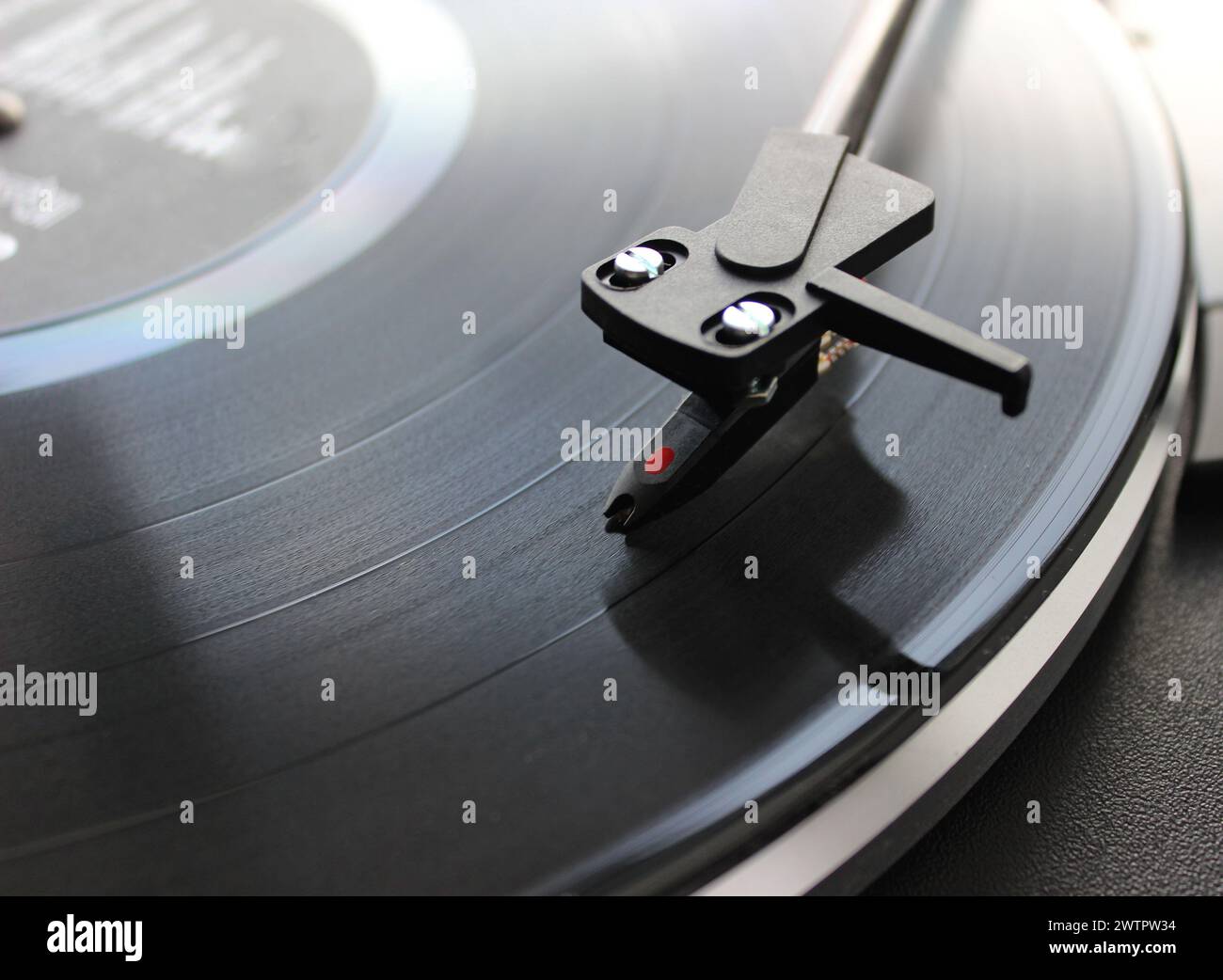 Turntable head on black vinyl disc top view detailed stock photo Stock ...