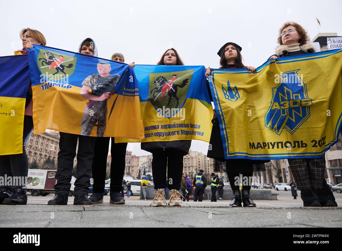 Ukrainian women hold flags of the brigades of Armed Forces of Ukraine ...