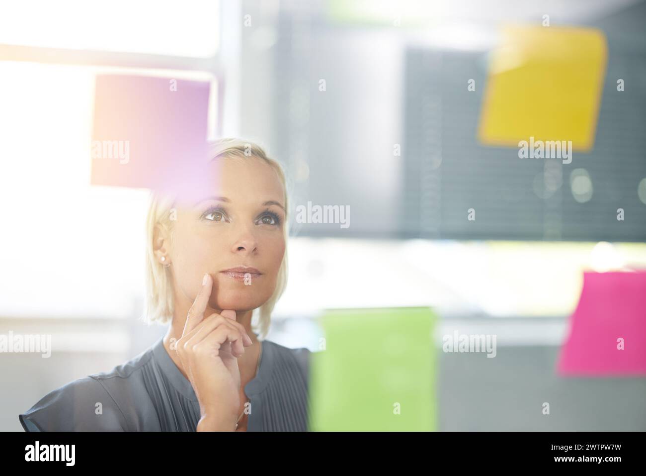 Woman, glass and board with thinking, planning and notes with reading ...