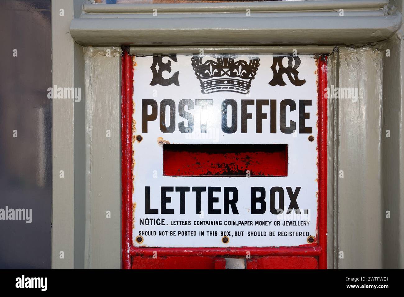 An old fashioned ER wall mounted Post Office letter box in the old town ...