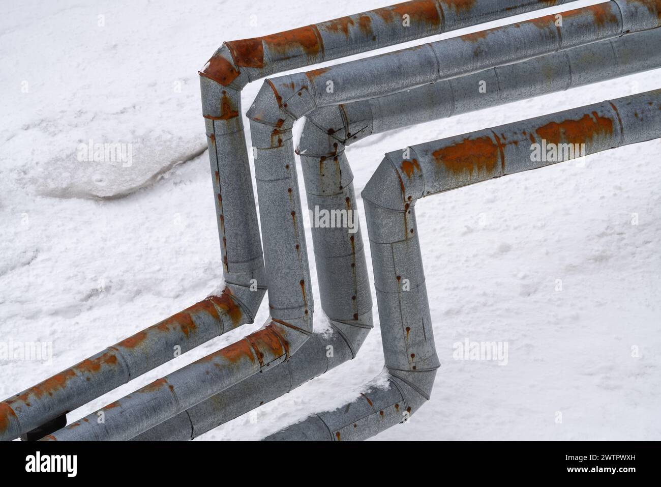 Pipes are visible in winter, protruding above snow after snowfall. External city central heating ...
