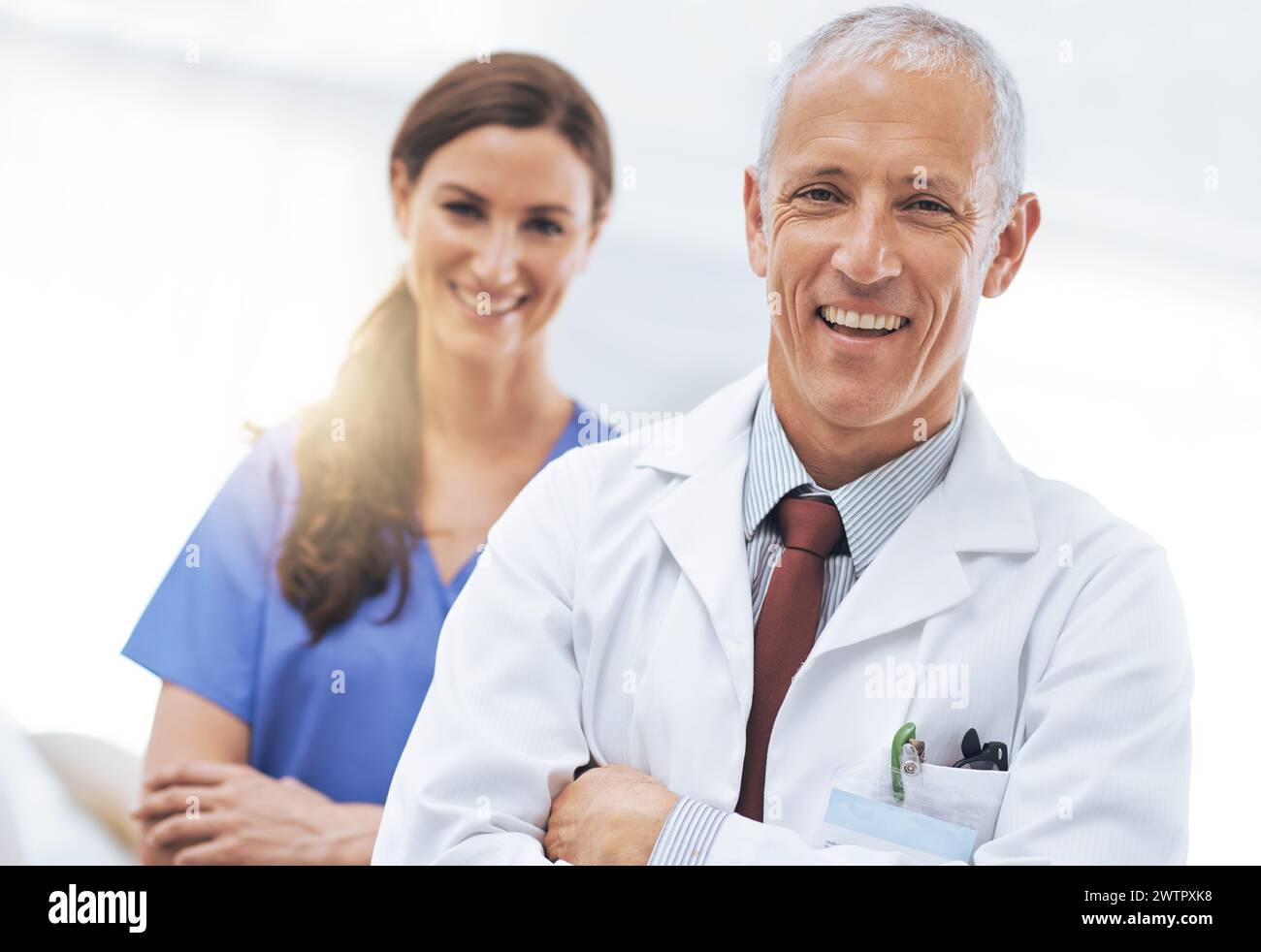 Doctor, nurse and partner in portrait with arms crossed, medical ...