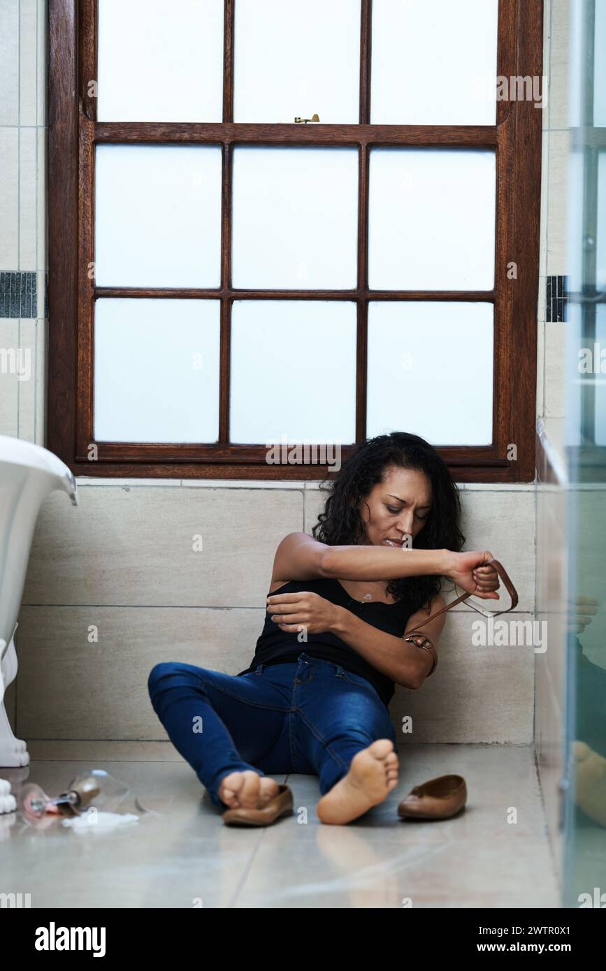 Woman, drug addict and floor in bathroom for addiction or disorder ...