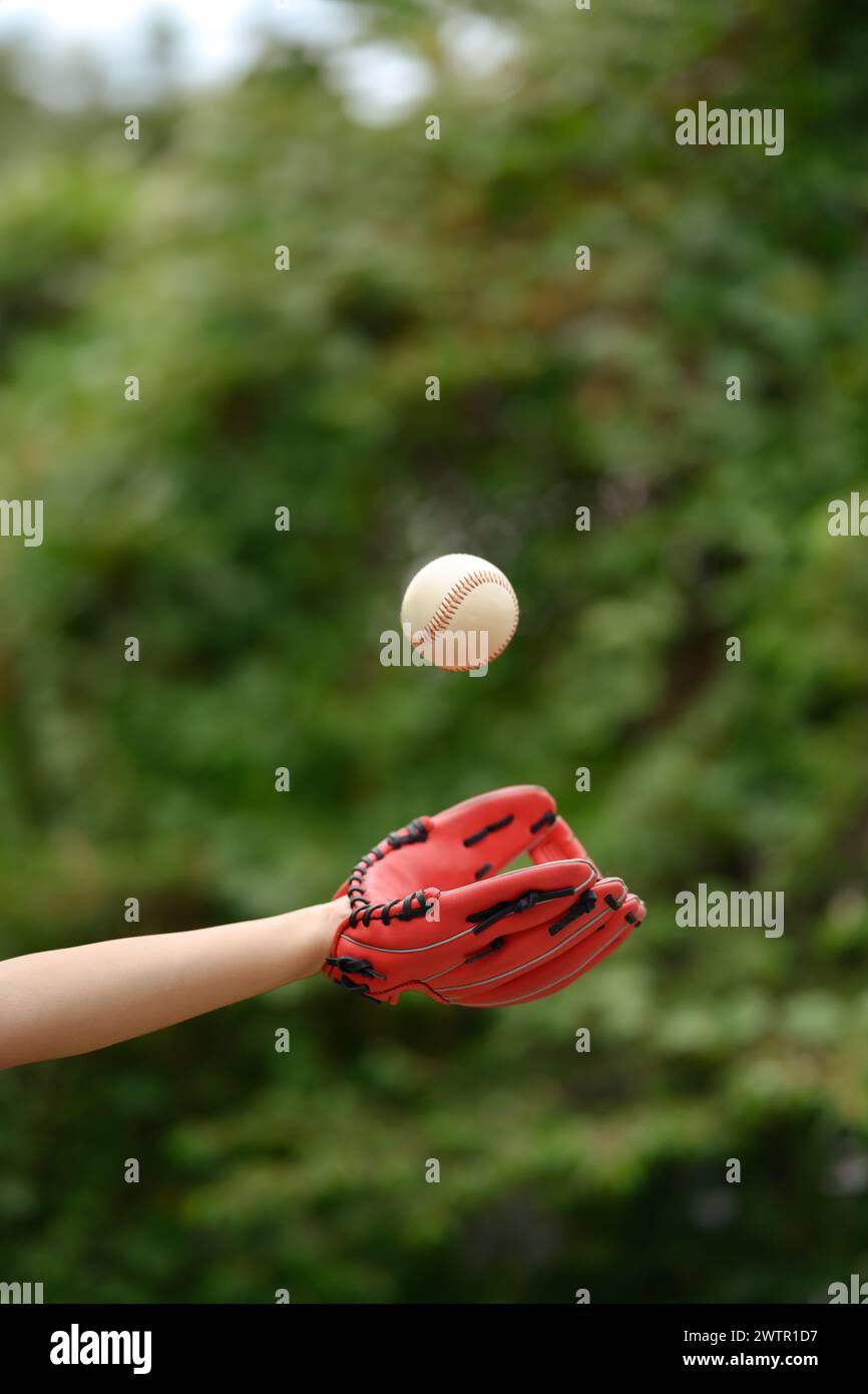 Baseball player in leather baseball glove catching a ball. Sport ...