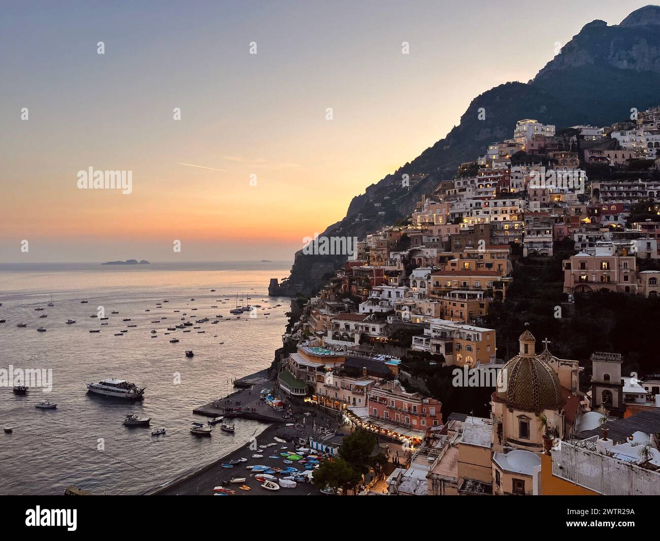 A scenic view of Positano at sunset. Amalfi Coast, Italy Stock Photo ...