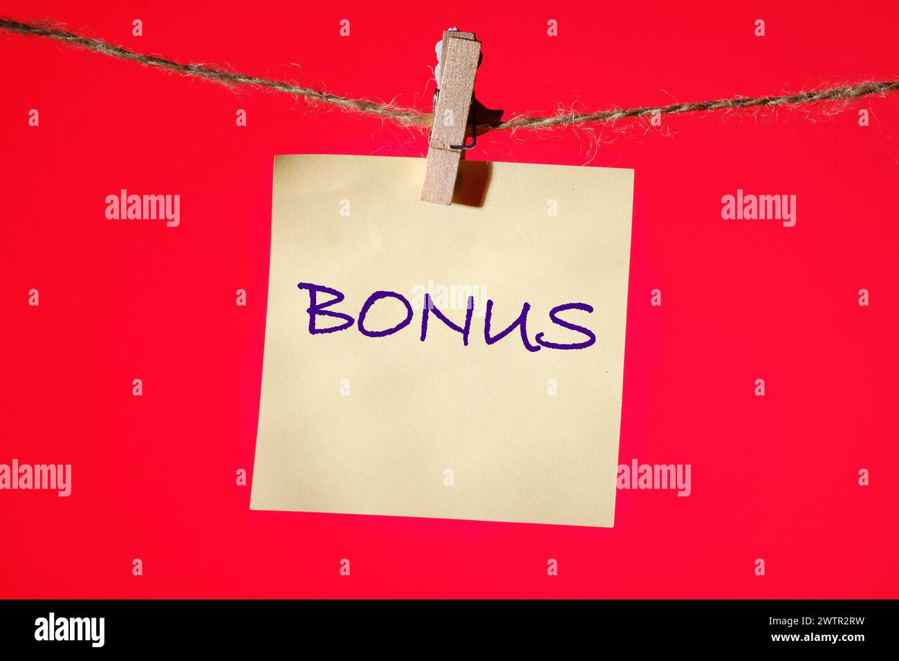 English Word Bonus written on a yellow sticker on a rope with a ...