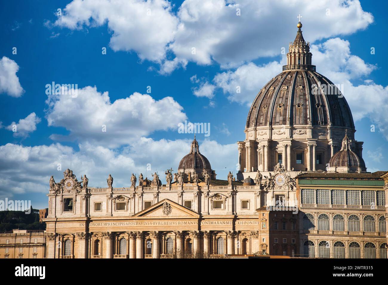St. Peter's Basilica at daylight with cloudy blue sky. Rome, Vatican ...