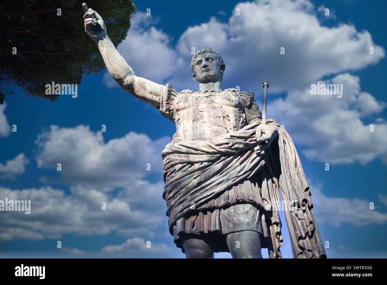 Statue of Emperor Trajan in Rome, Italy. Bright blue sky on background ...