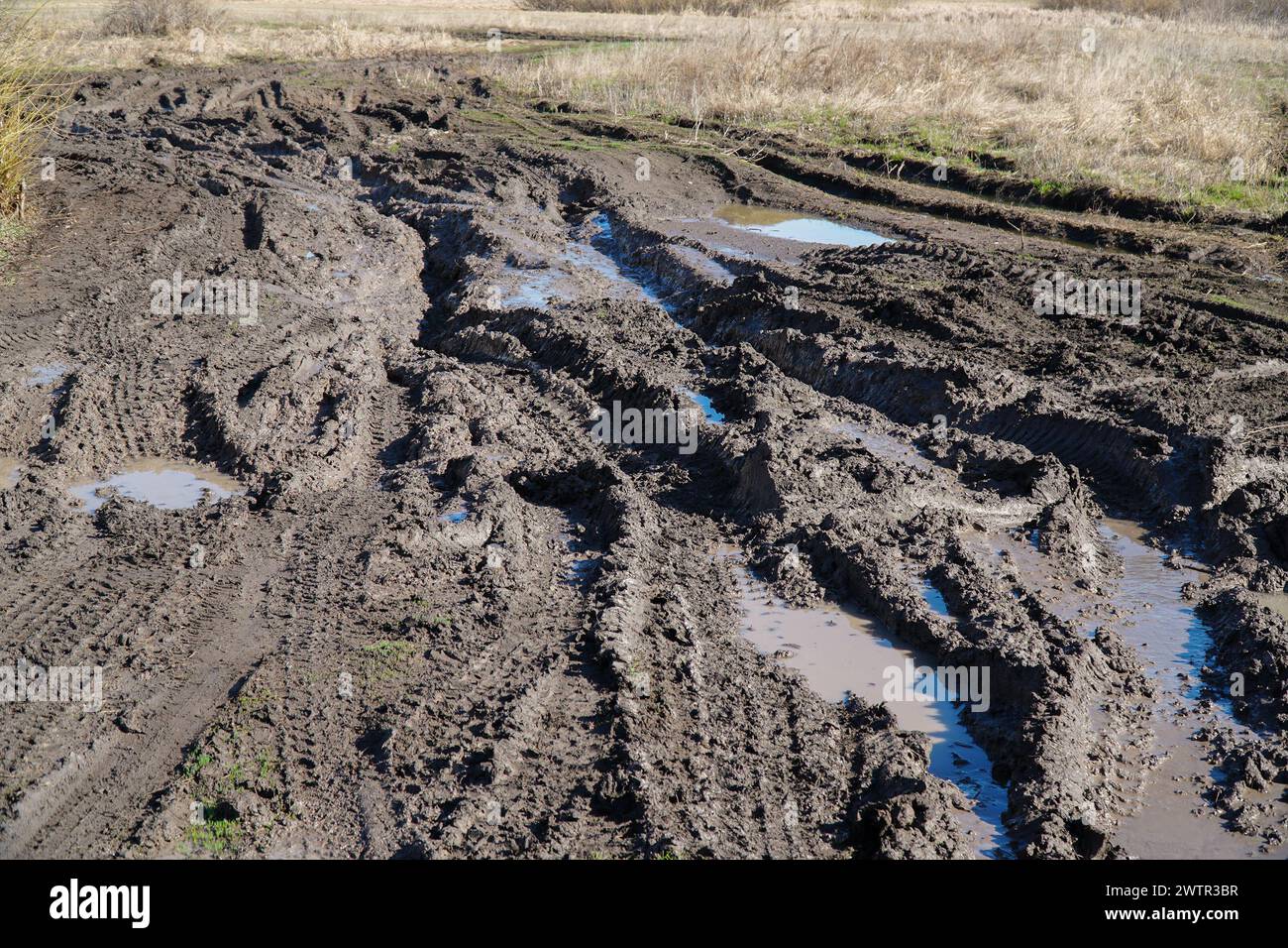 A dirty impassable country road with deep ruts Stock Photo - Alamy