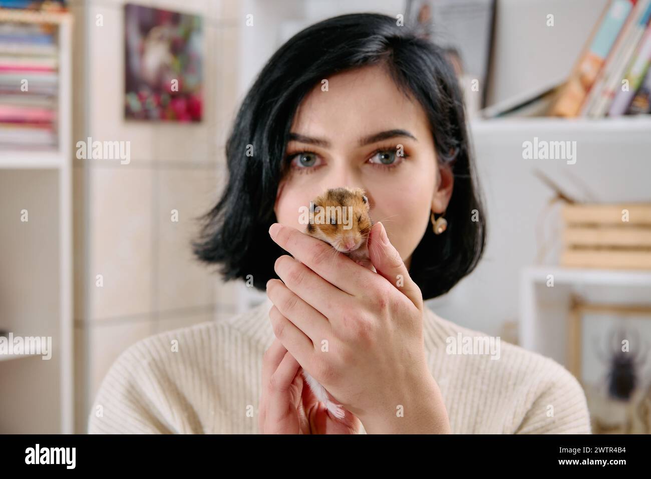 A Black-Haired Beauty Enjoys a Cozy Day at Home with Her Pet Mouse ...