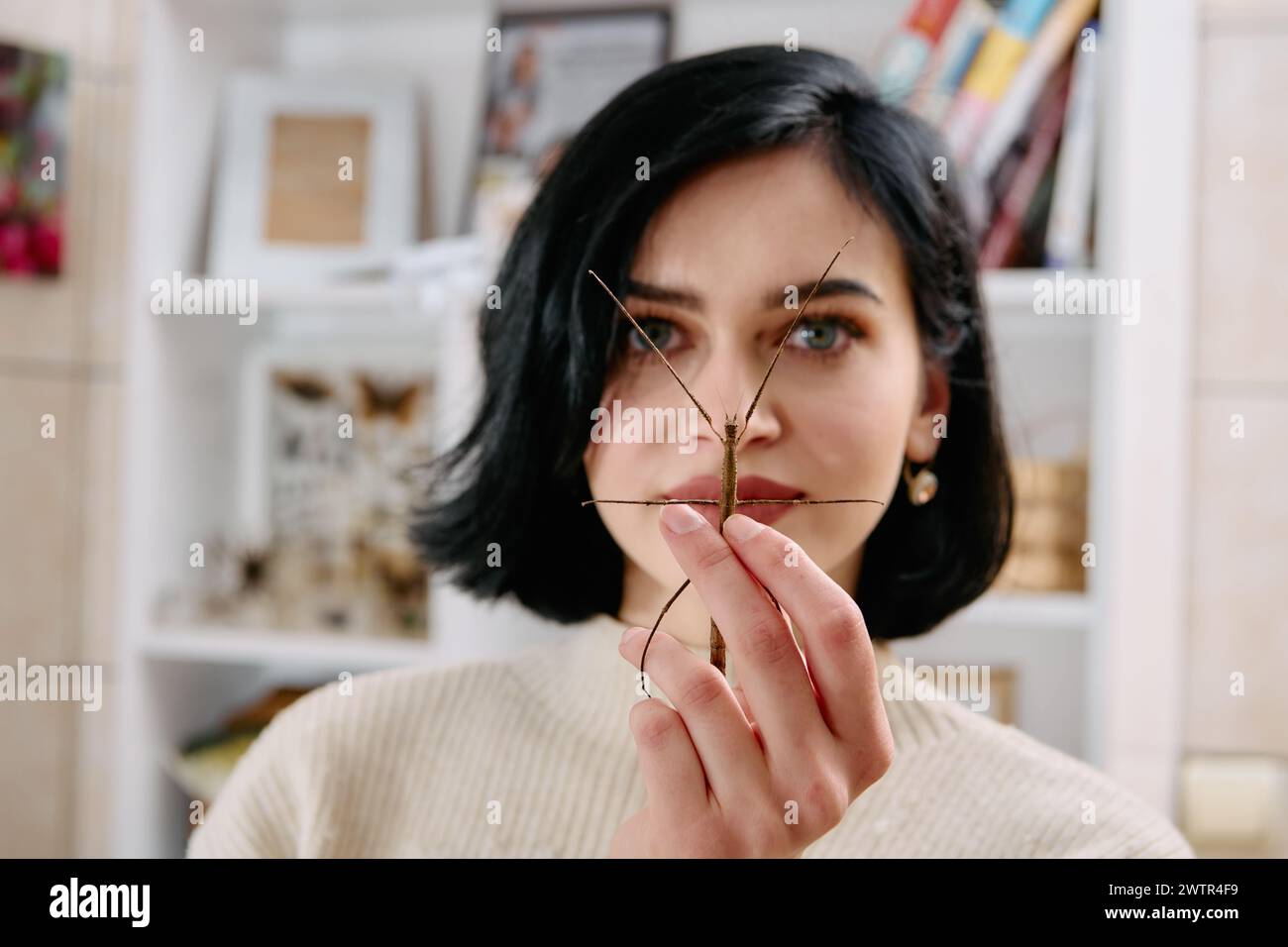 Young Woman Captured in a Beautiful Moment with Her Stick Insect ...