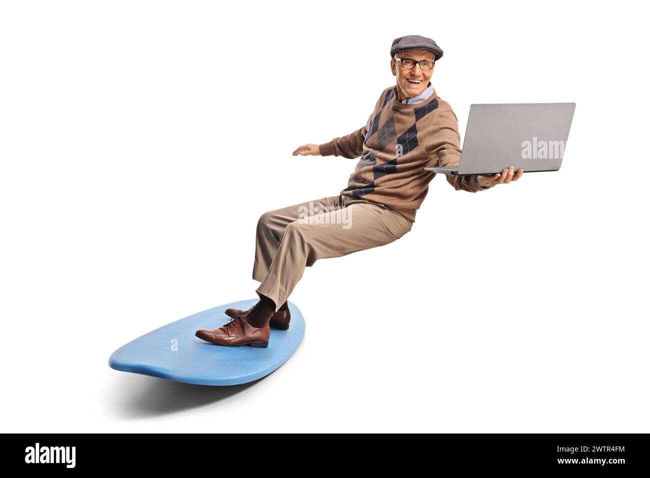 Elderly man surfing with a surfboard and holding a laptop computer ...