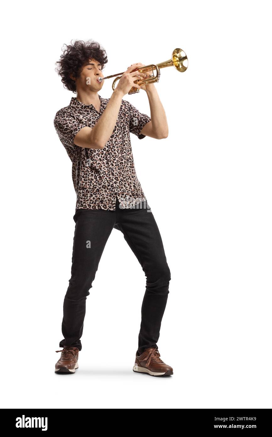 Full length shot of a guy playing a trumpet isolated on white ...