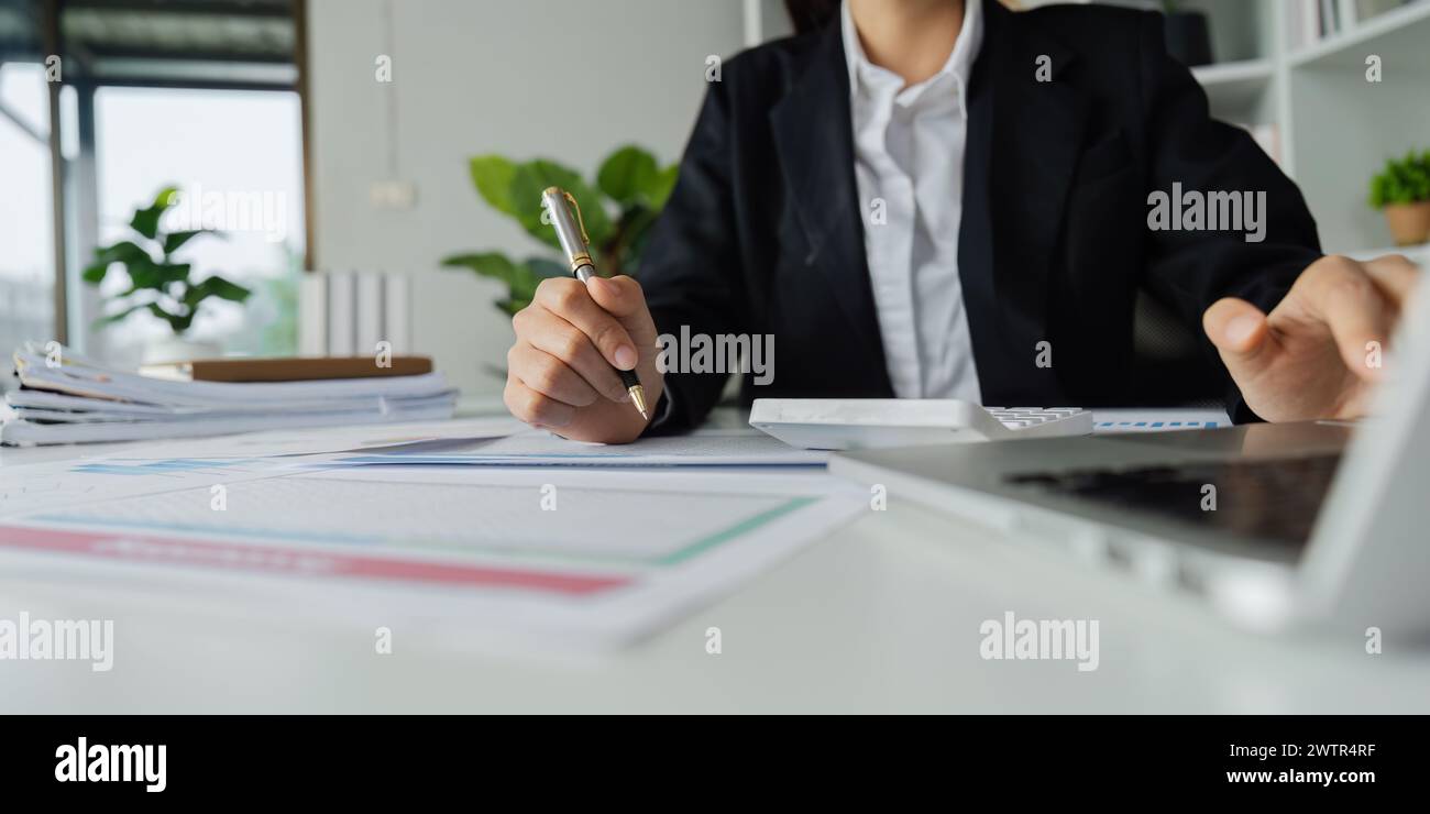 Accountant working on financial data analysis dashboard on paper as ...
